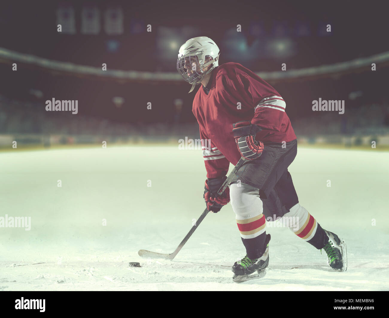 ice hockey player in action kicking with stick Stock Photo - Alamy