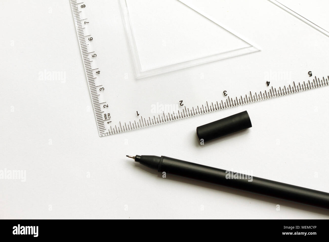 Mathematical accessories. Triangle ruler for math and black pen for ...