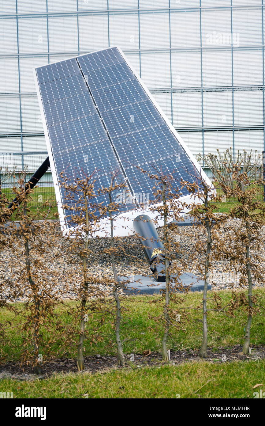 Blue rotating solar panels tilted axis tracker, future energy concept ...