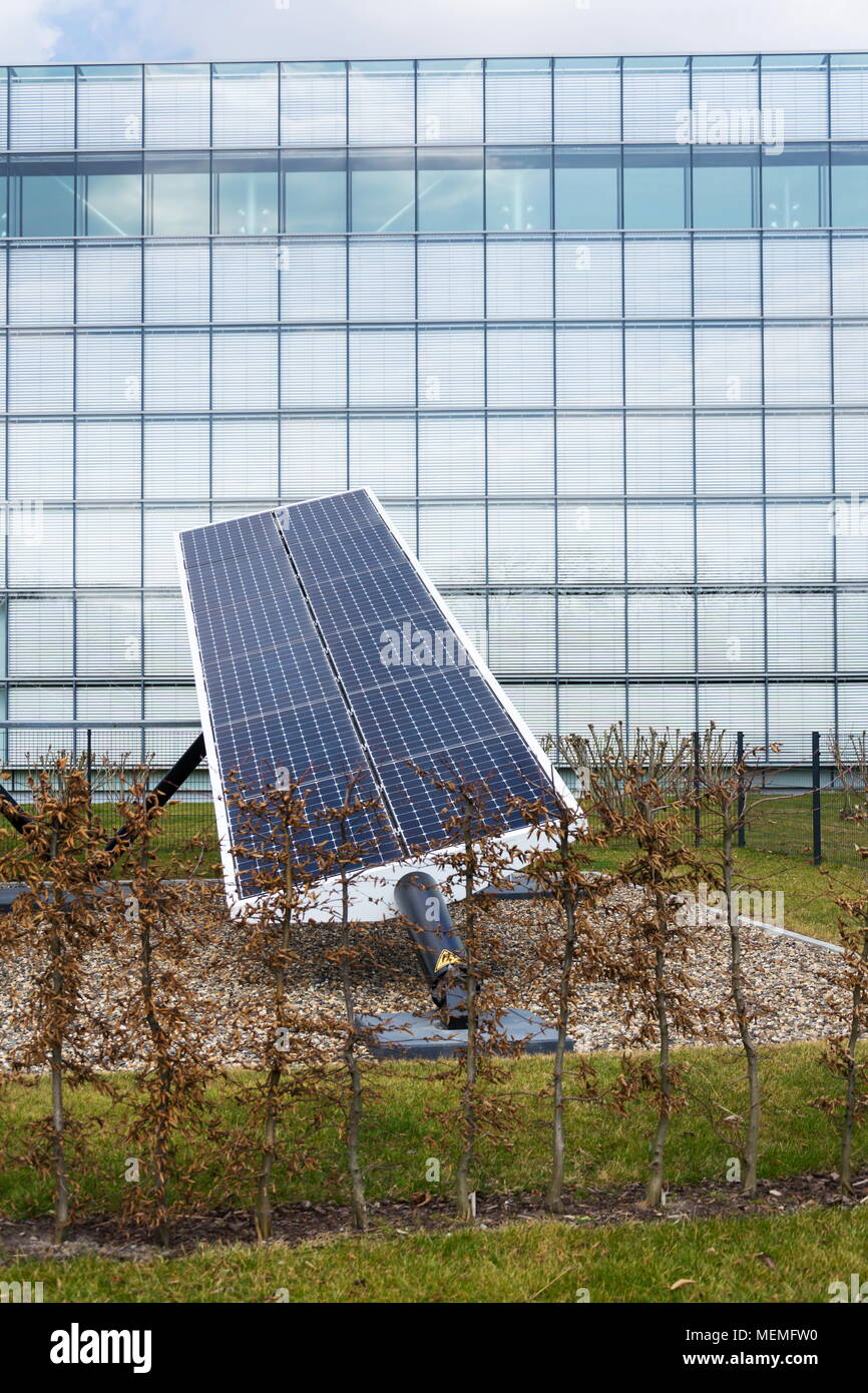 Blue rotating solar panels tilted axis tracker, future energy concept ...