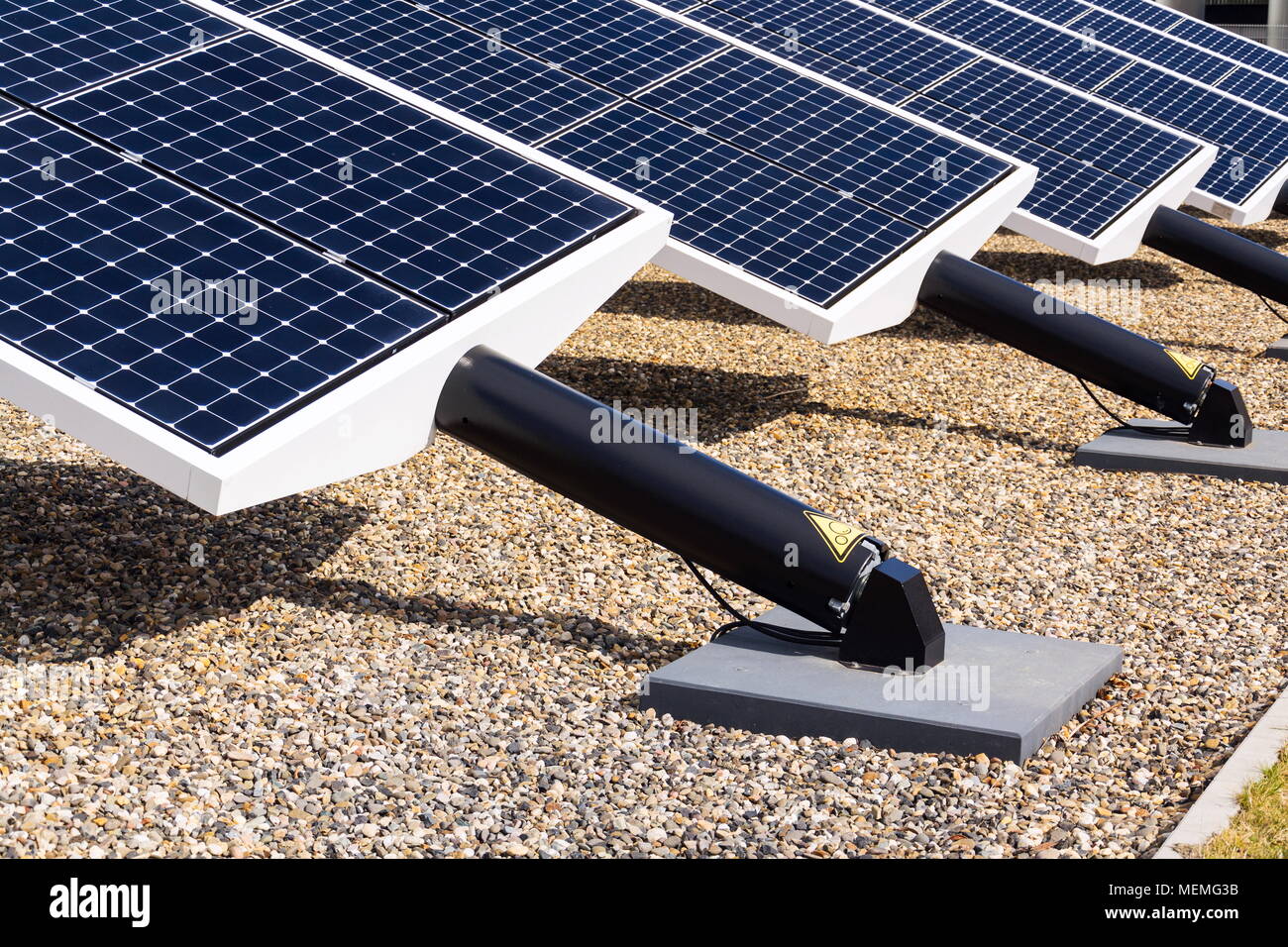 Blue rotating solar panels tilted axis tracker, future energy concept ...