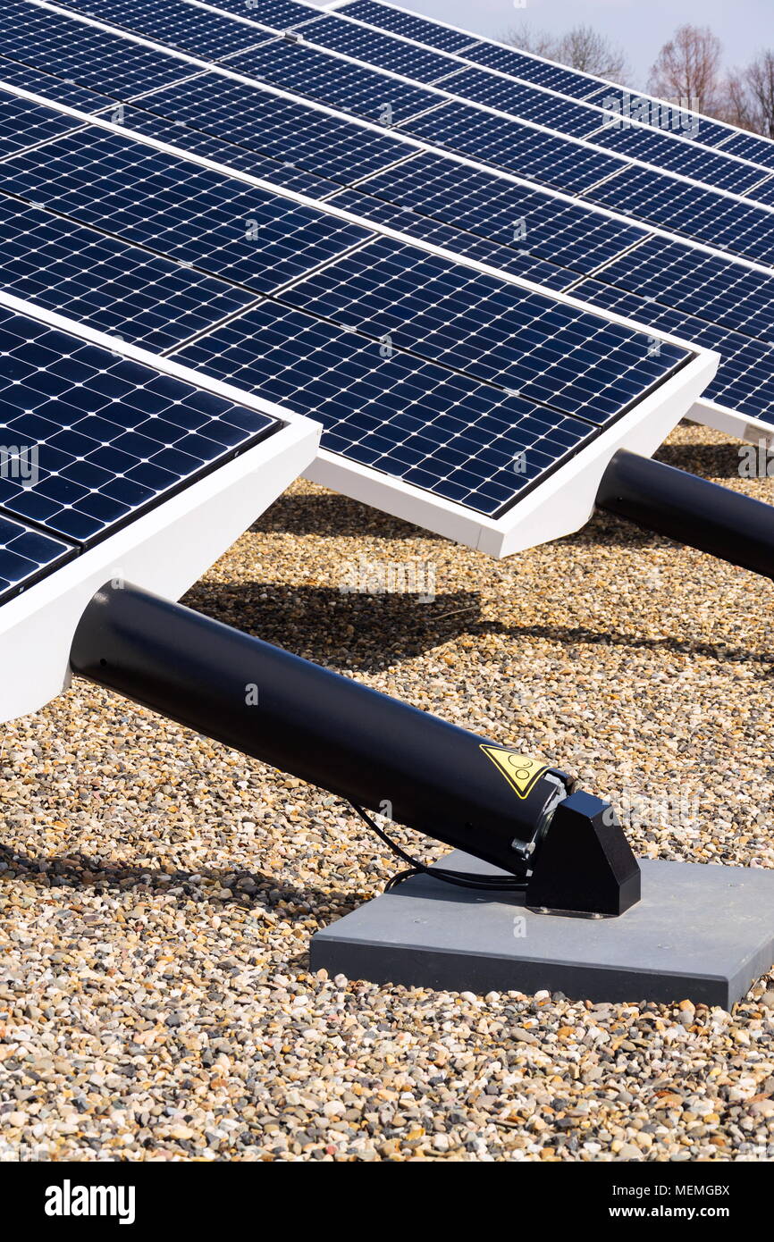 Blue rotating solar panels tilted axis tracker, future energy concept ...