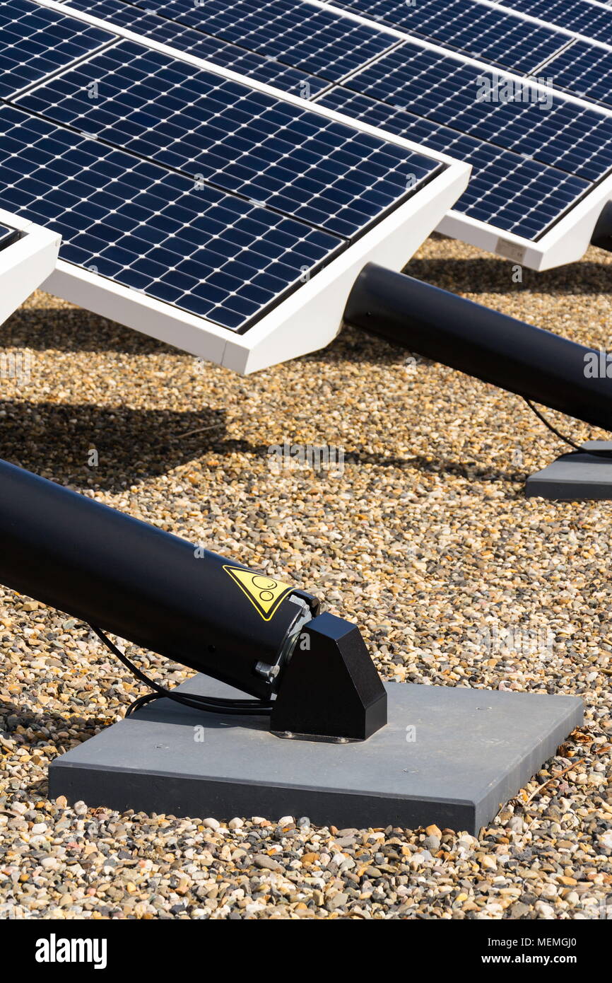 Blue rotating solar panels tilted axis tracker, future energy concept ...