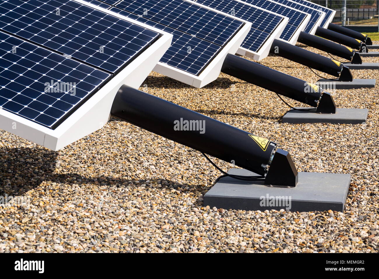 Blue rotating solar panels tilted axis tracker, future energy concept ...