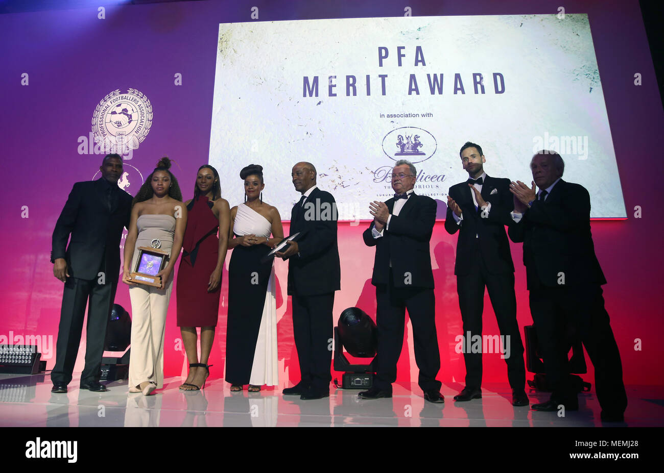 Family members collect the PFA Merit Award after it is awarded ...