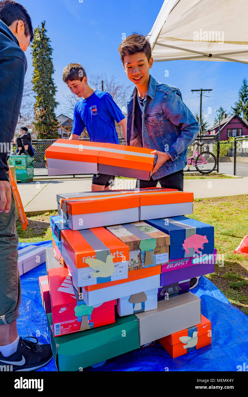 Teen playing Environmental Jenga game, species are all interconnected ...