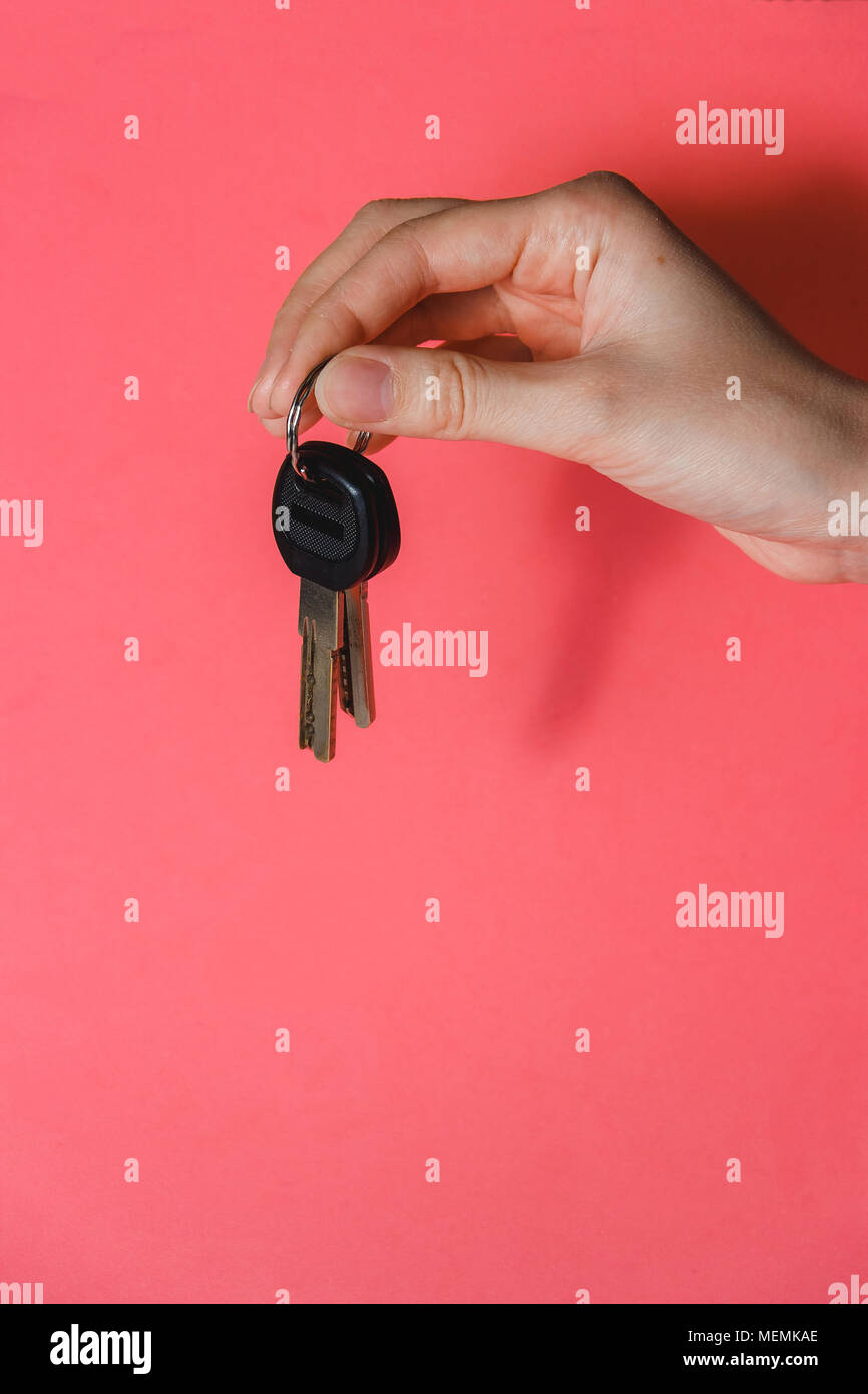 Human Hand Holding Key to Dream Started House against Pink Background ...