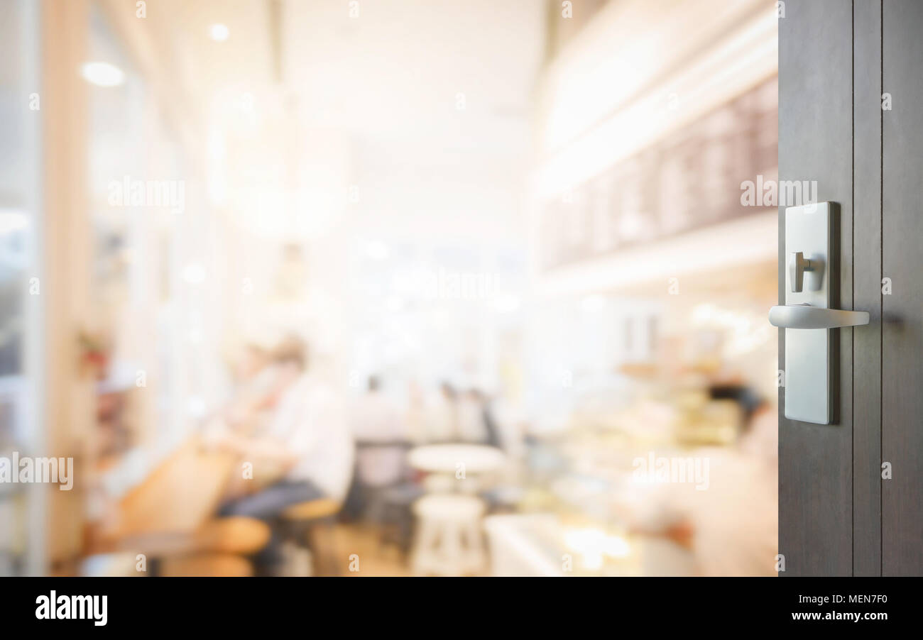 opened wooden door to coffee shop interior as background Stock Photo ...