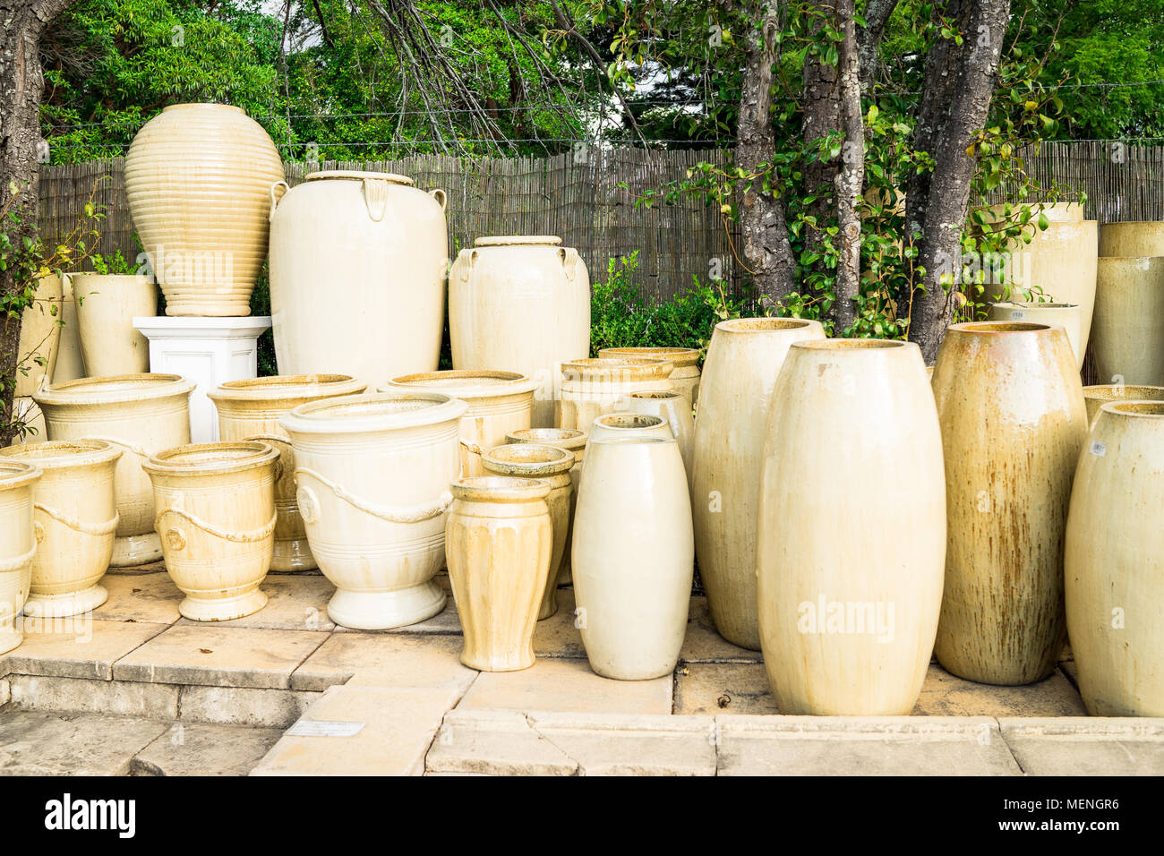 Cream coloured stone flower pots at a Plant Nursery Stock Photo - Alamy