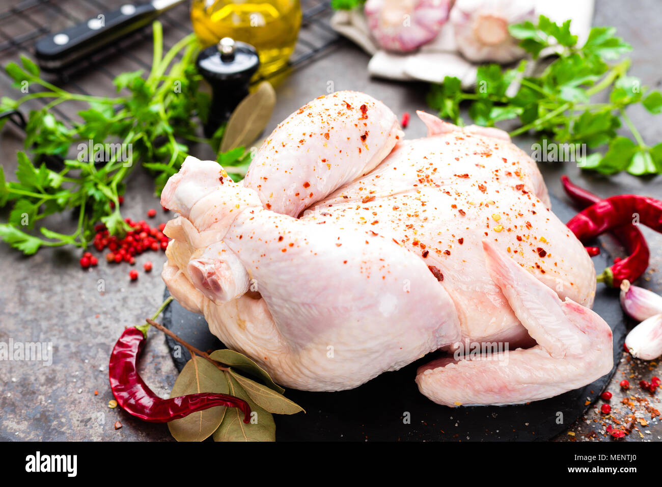 Raw chicken. Fresh whole chicken with ingredients for cooking Stock ...
