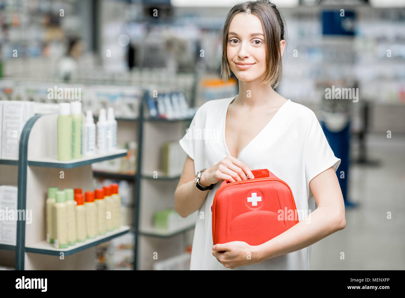 Woman with first aid kit in the pharmacy Stock Photo - Alamy