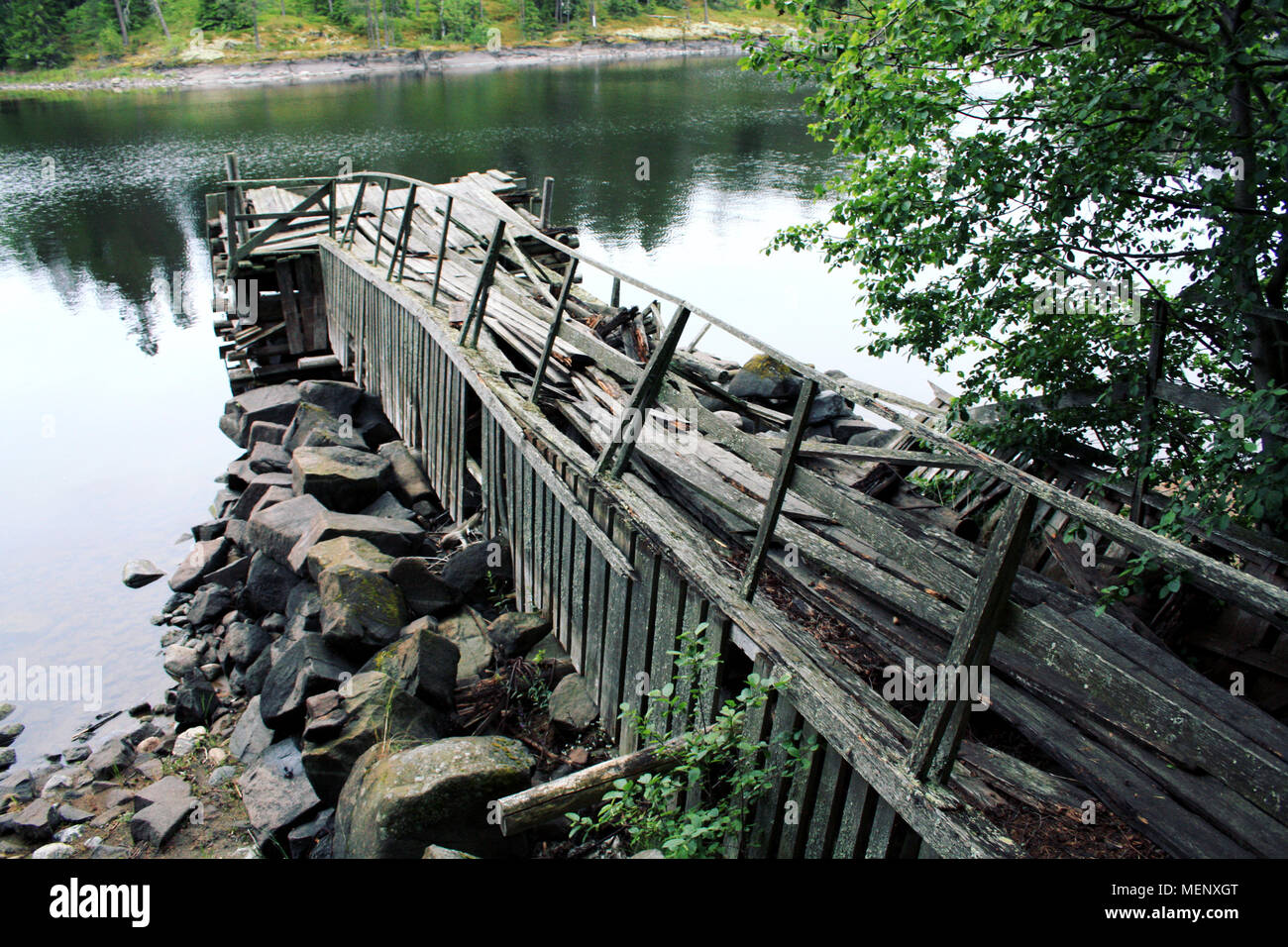 An Abandoned pier near The Skete of All Saints. Aged photo. Summertime ...
