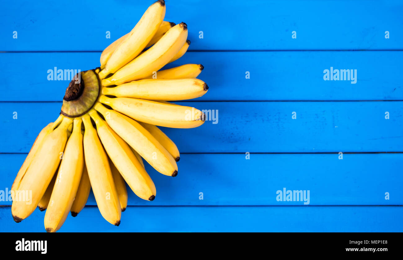 Raw Organic Yellow Baby Bananas in a Bunch Stock Photo - Alamy