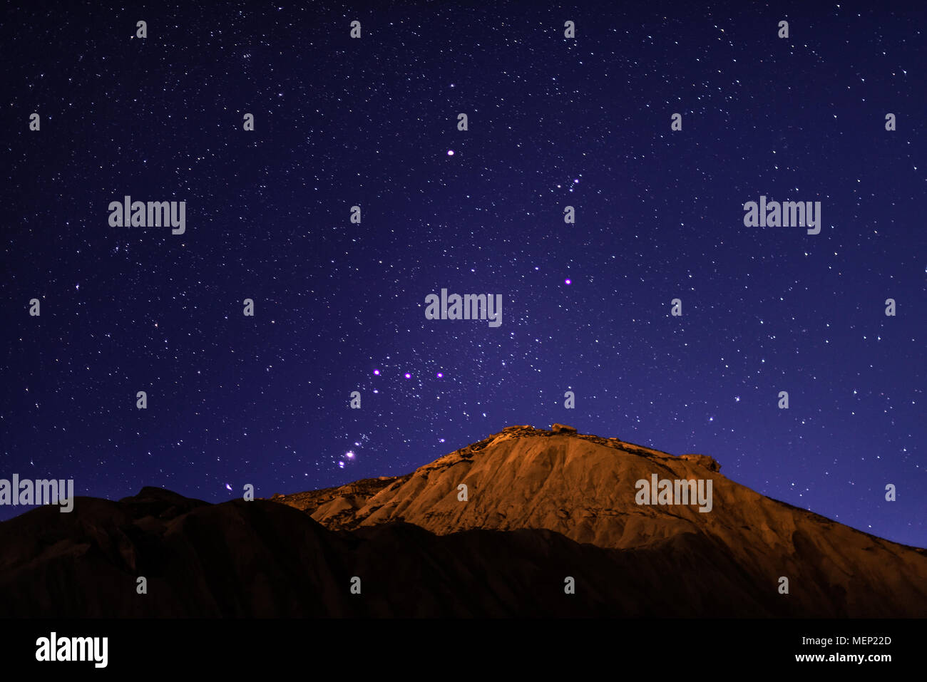 Mountain peak in starry night Stock Photo - Alamy