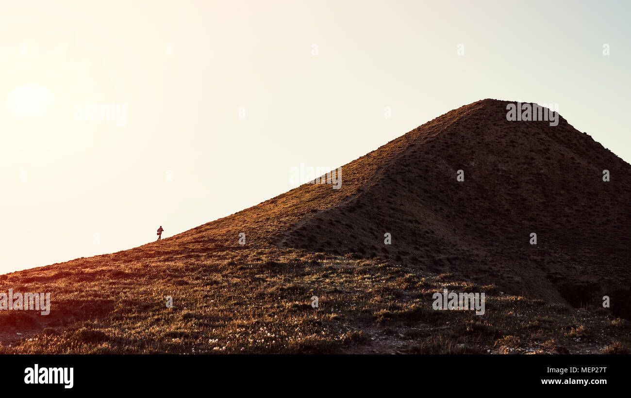 Traveler climbs mountain peak hi-res stock photography and images - Alamy