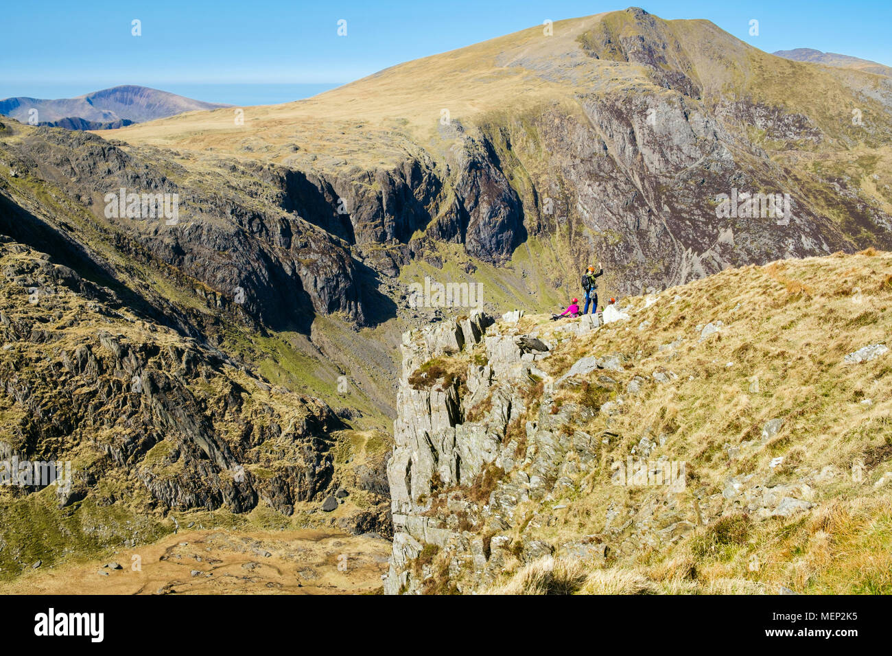 Climbers on Cneifion Arete on Y Gribin ridge on Glyder Fawr with Y Garn ...
