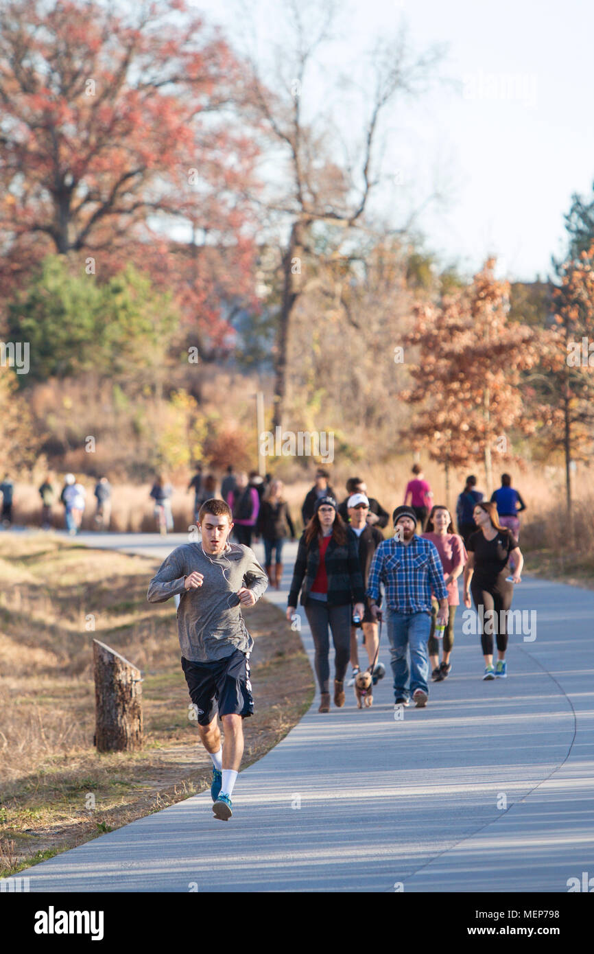 People walk and run along the Atlanta Beltline recreational area in the ...