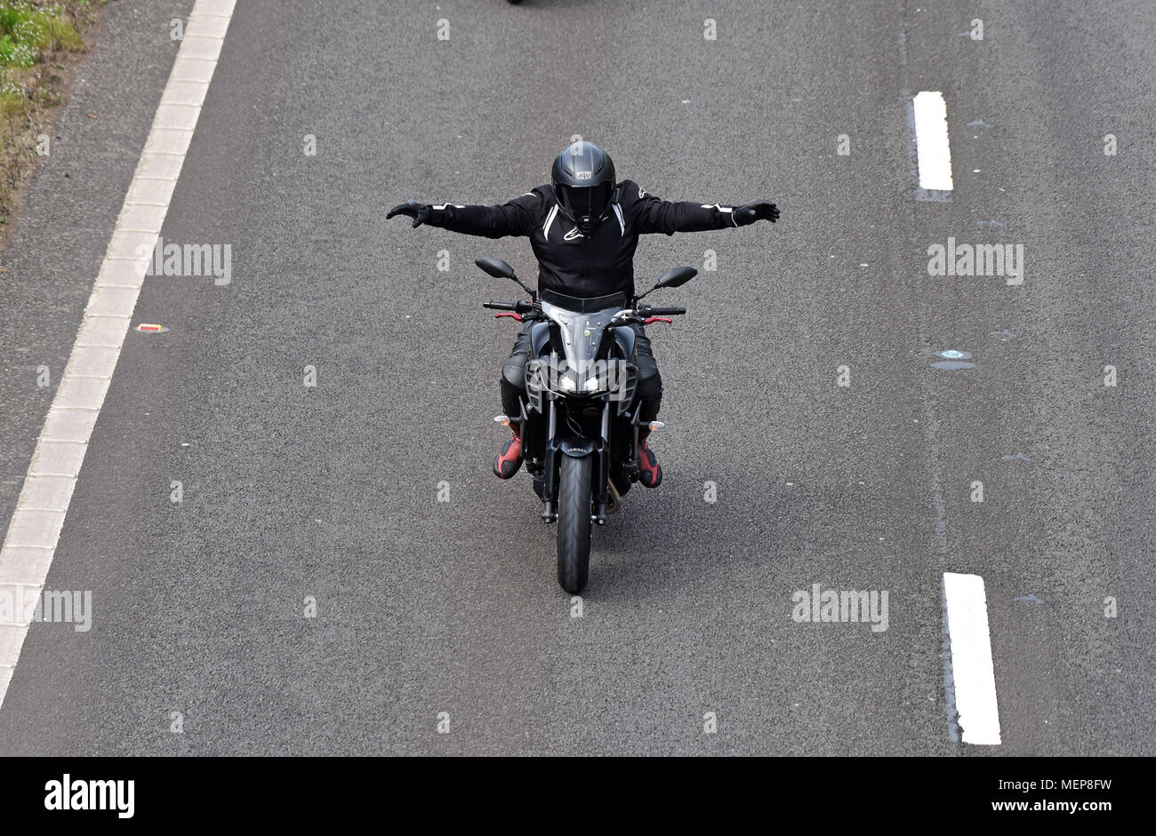 Hands free motorcyclist hi-res stock photography and images - Alamy