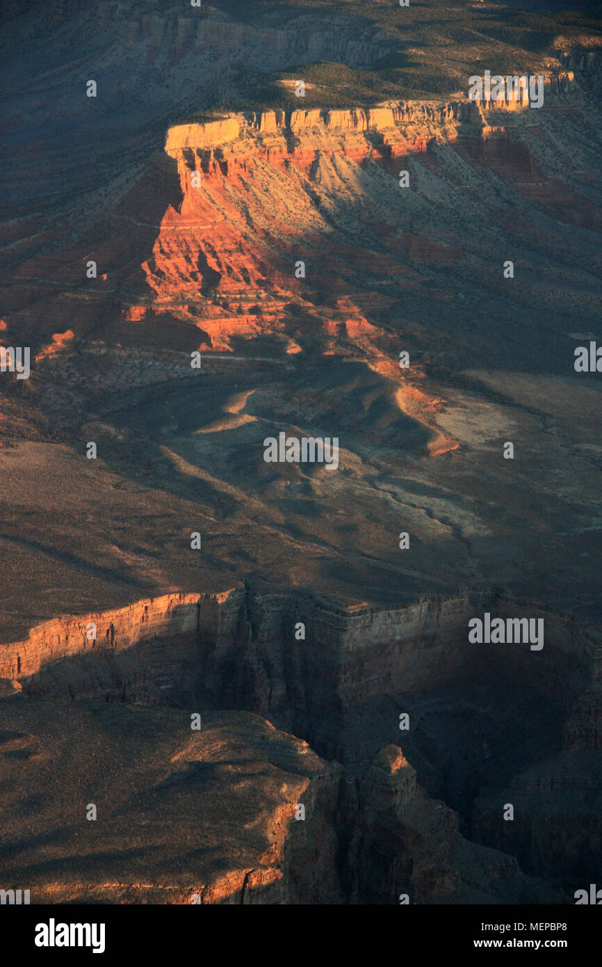 First Sun Rays of the Day illuminating a Rock Formation in the Grand ...