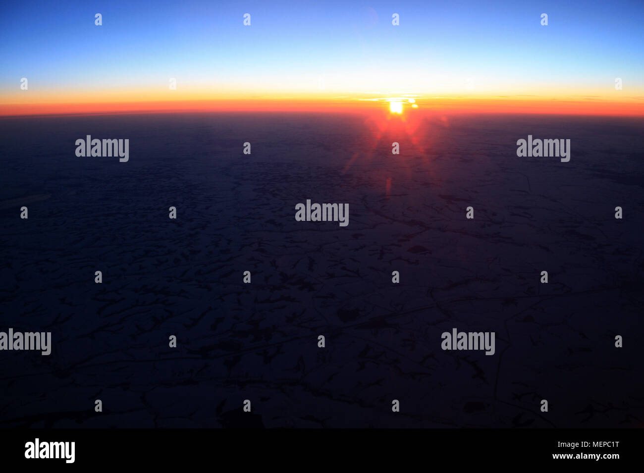 Aerial View of a beautiful Sunset overhead a Winter Landscape Stock ...