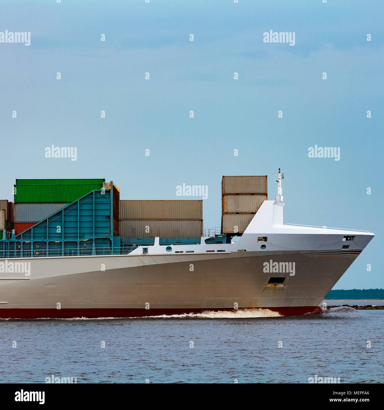 Grey container ship. Logistics and production import Stock Photo - Alamy