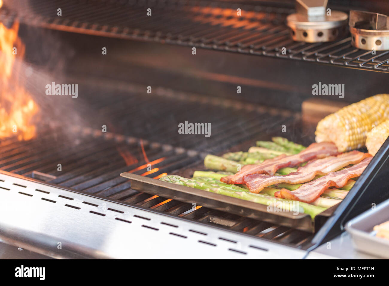 Step by step. Cooking hamburgers on outdoor gas grill in the Summer ...