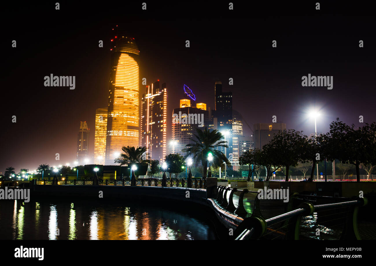 Abu Dhabi modern cityscape view from Corniche at night Stock Photo - Alamy