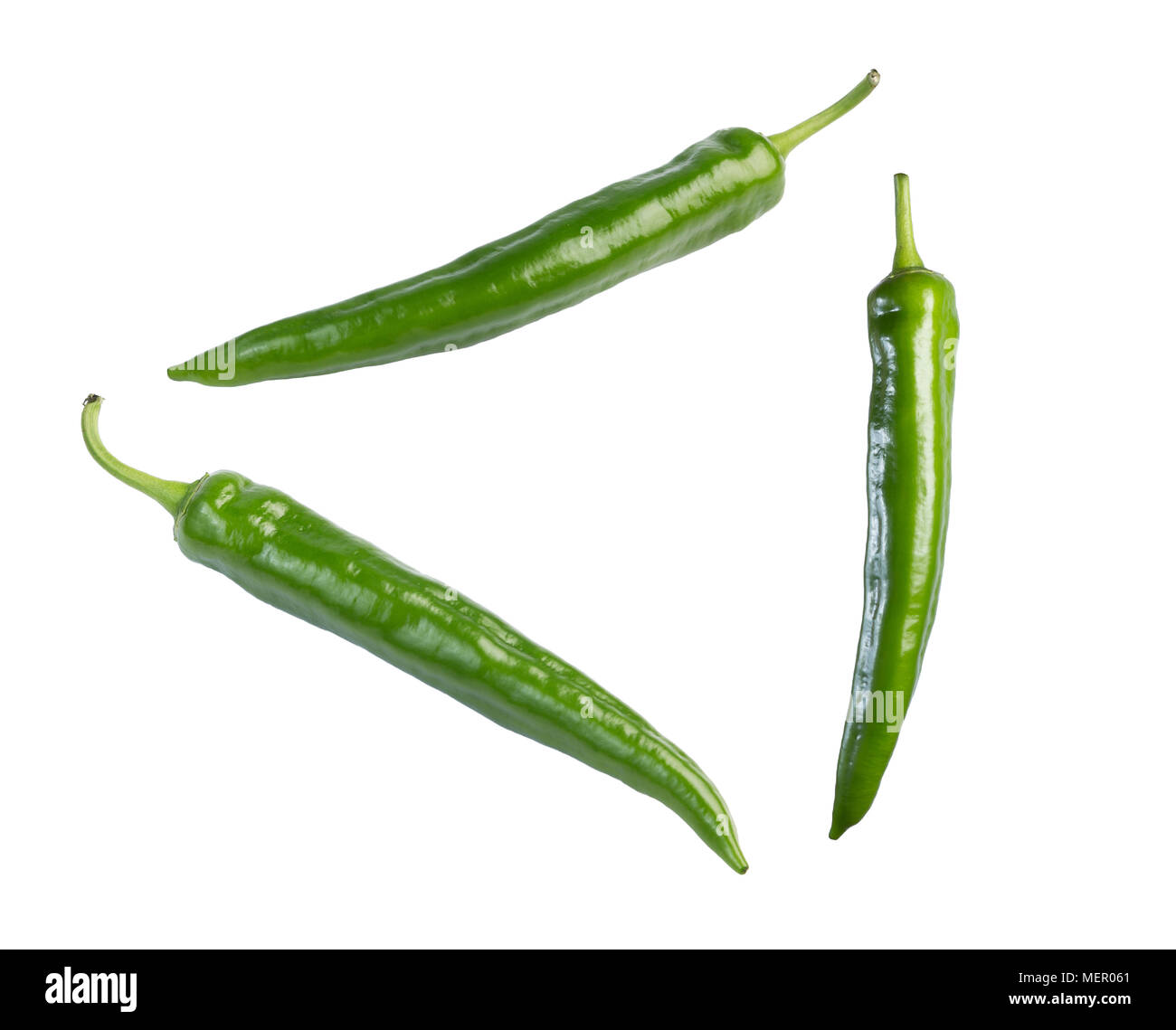 Three green color pepper isolated Stock Photo - Alamy