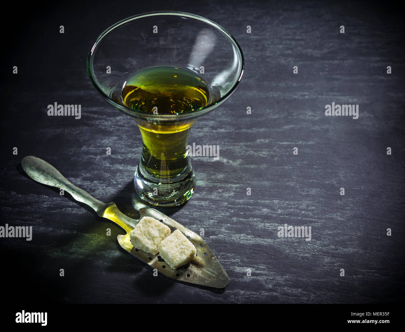 Photo of a glass of absinthe with spoon and sugar cubes Stock Photo - Alamy