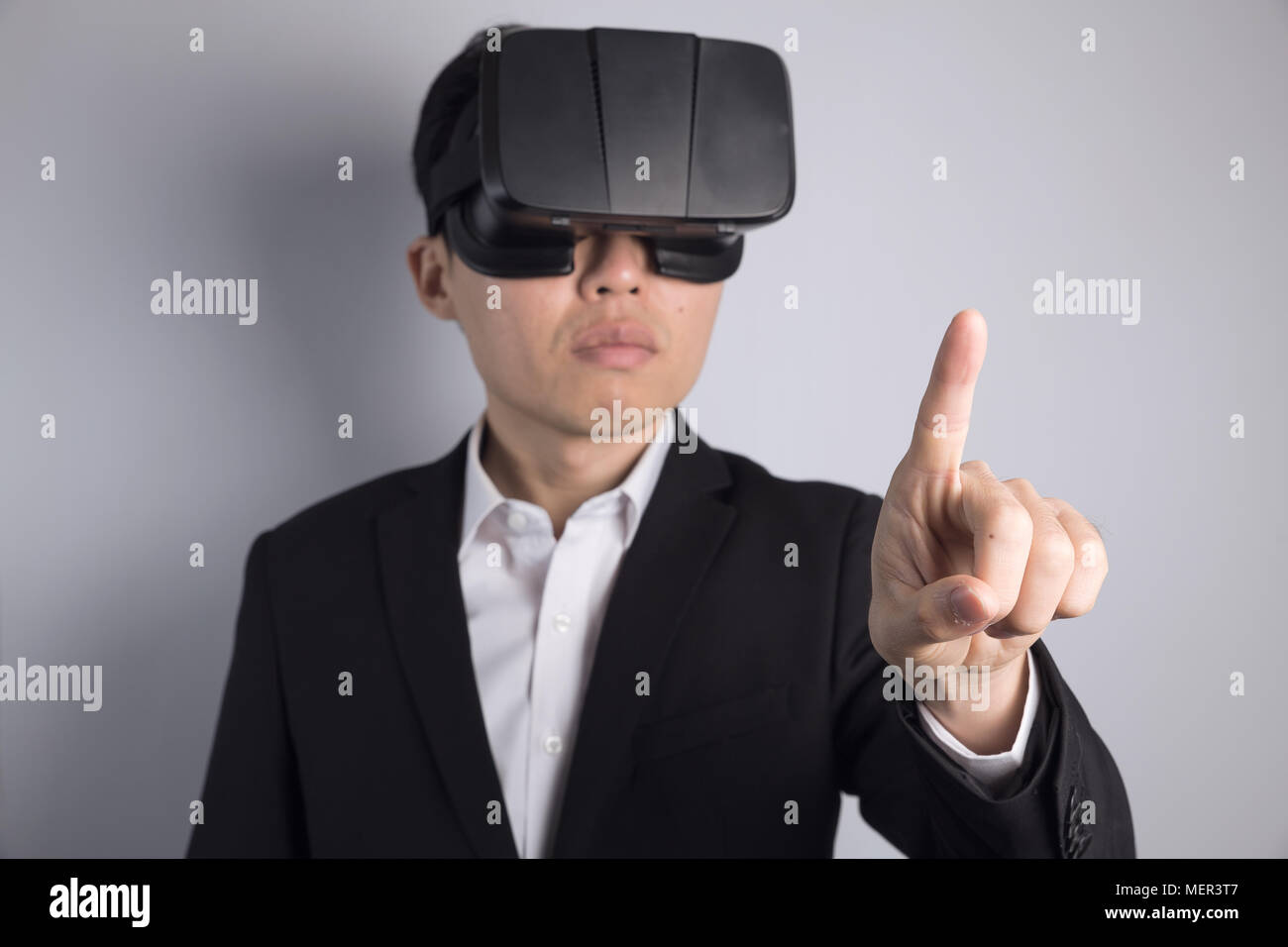 Asian man touching with vr glasses Stock Photo - Alamy
