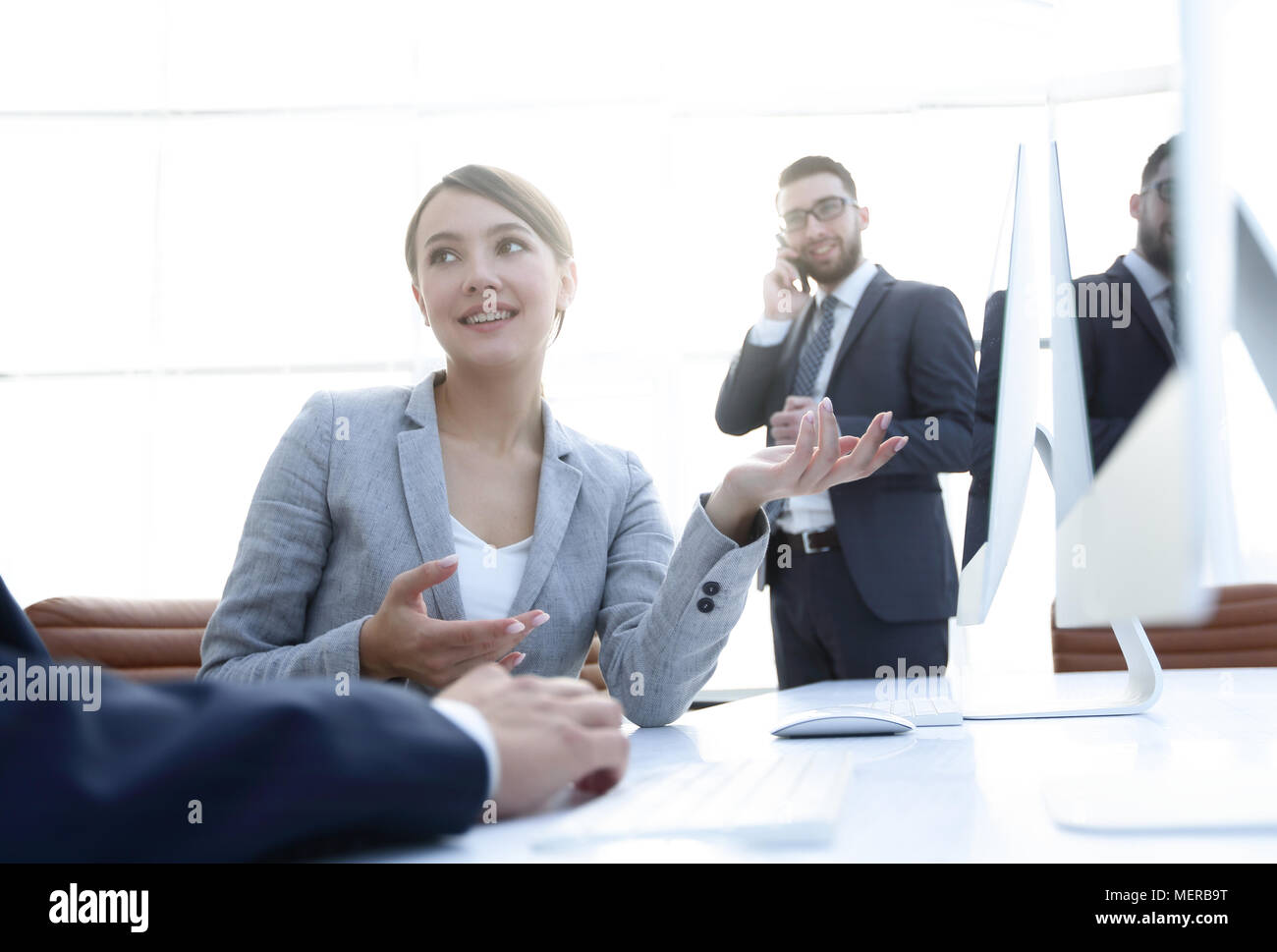 female consultant communicating with the client Stock Photo - Alamy