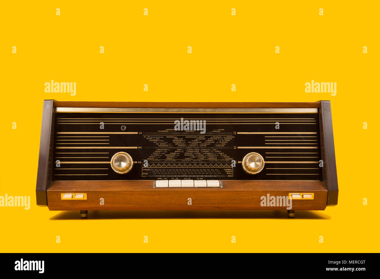 Old antique radio seen from the front on a yellow background Stock ...