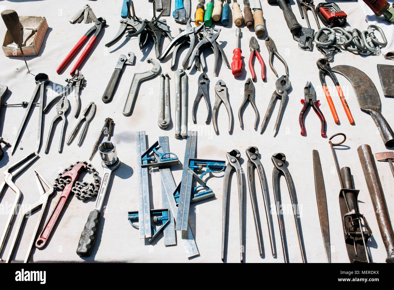Set of old, new and vintage tools in a flea market in a sunny day in ...