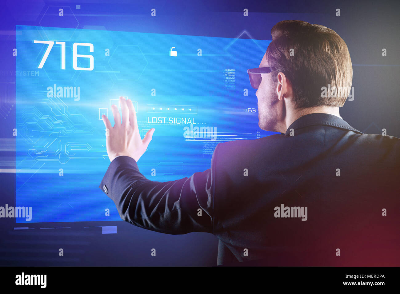 Attentive programmer carefully touching the screen of his futuristic computer Stock Photo - Alamy