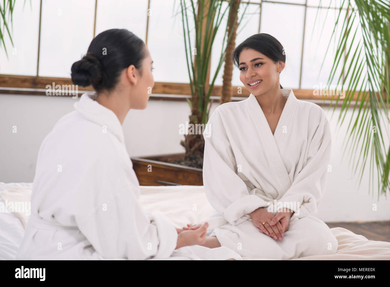 Positive happy friends talking Stock Photo - Alamy