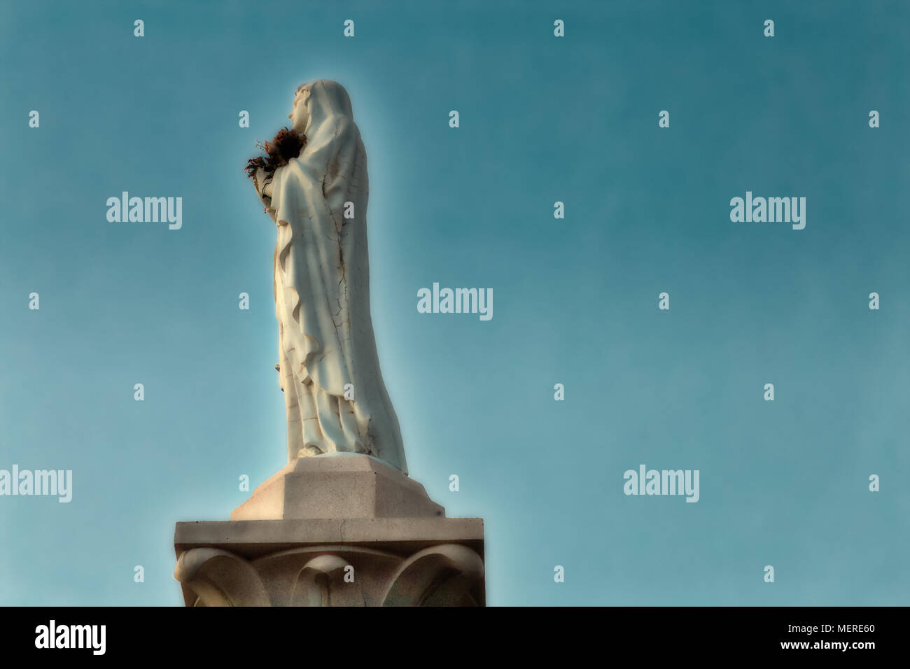 statue of The Blessed Virgin Mary on blue sky background Stock Photo ...