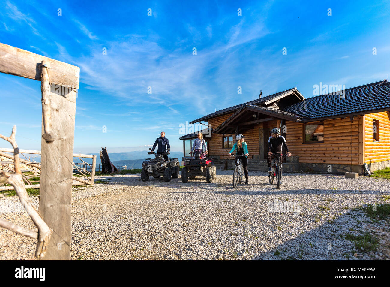 Group of friends is about to start adventure on mountain bikes and atv ...