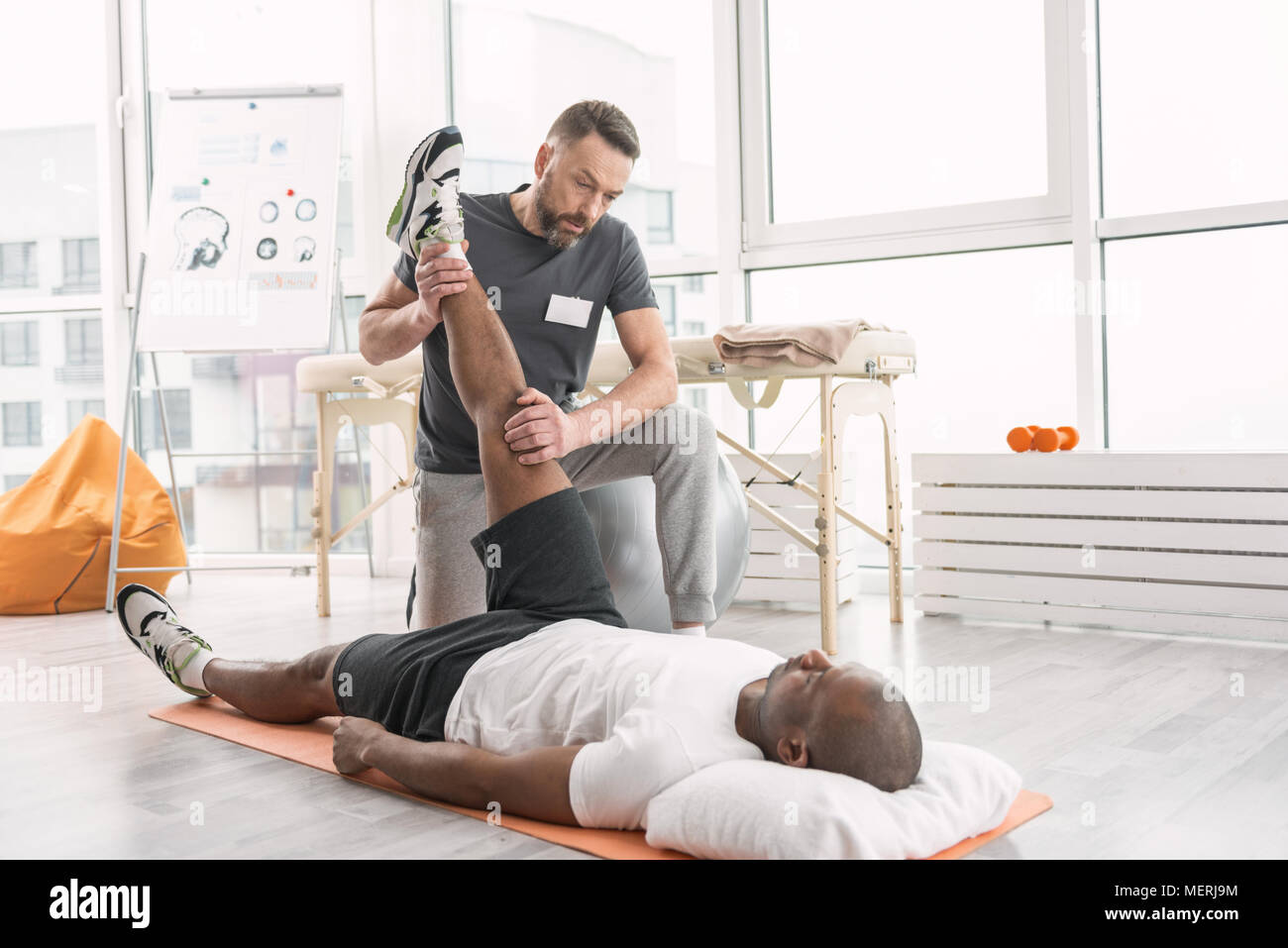 Nice handsome man lying on the floor Stock Photo - Alamy