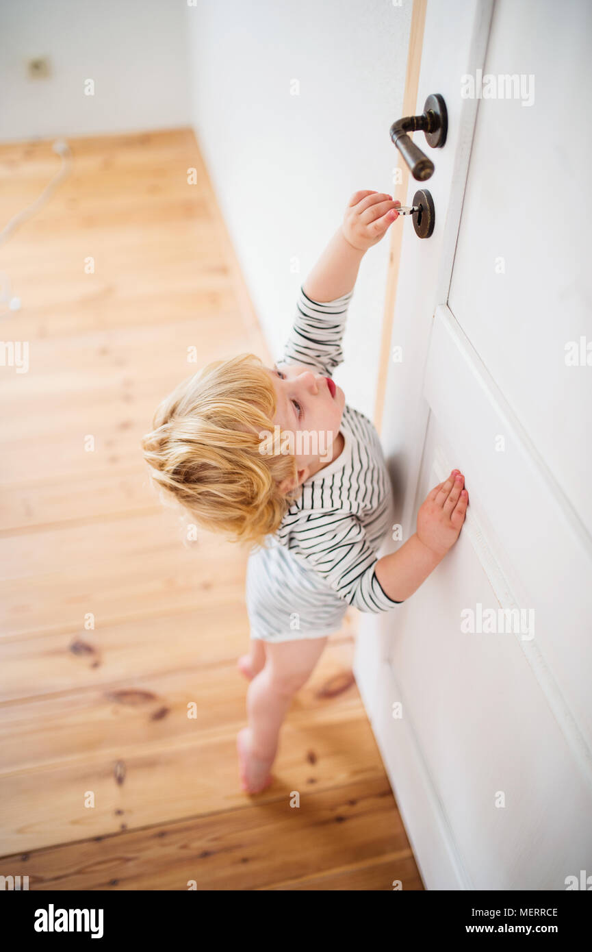 Toddler child in a dangerous situation at home Stock Photo - Alamy