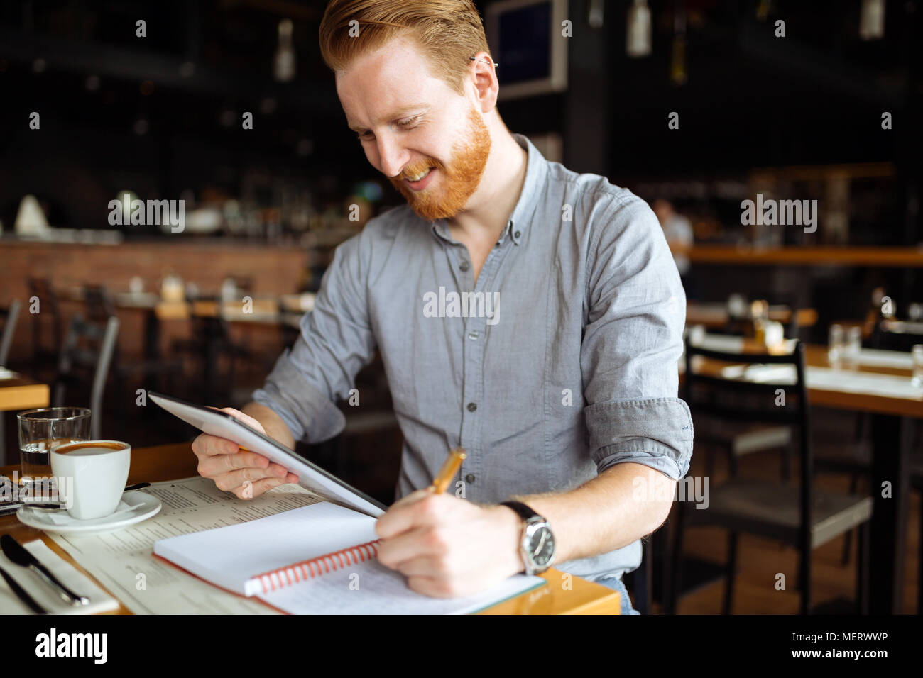 Businessman taking notes Stock Photo - Alamy