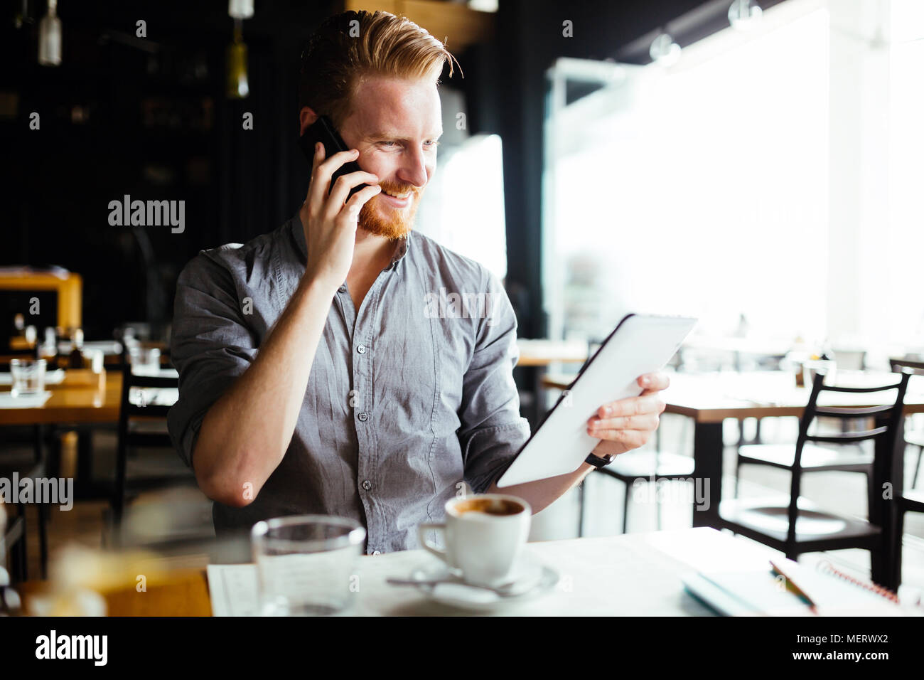 Businessman constantly working Stock Photo - Alamy