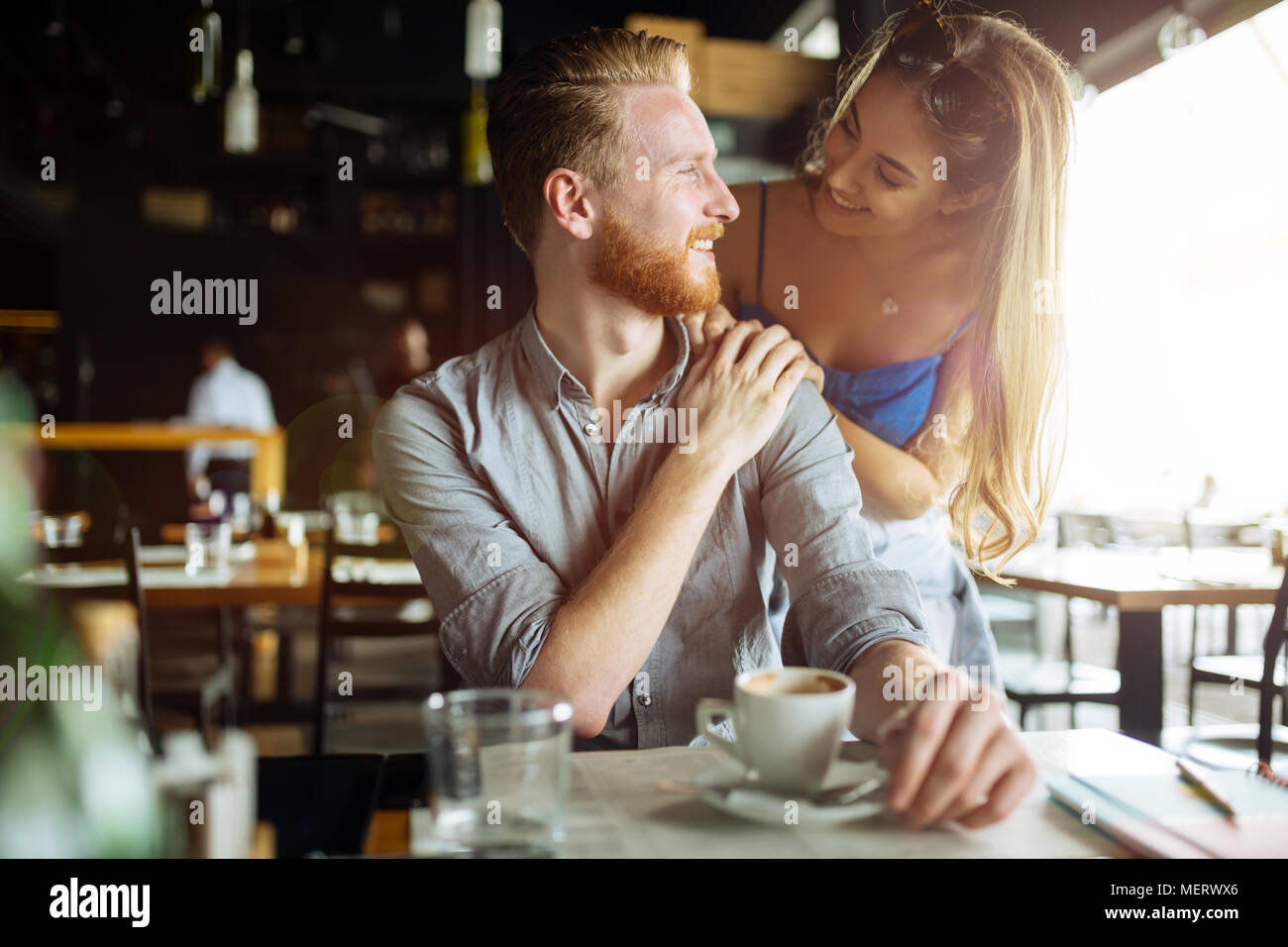 Beautiful man and woman flirt Stock Photo - Alamy