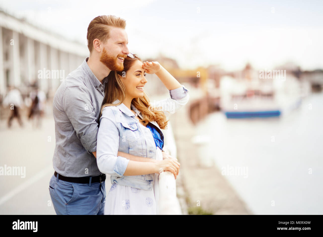 Beautiful young laughing couple hi-res stock photography and images - Alamy