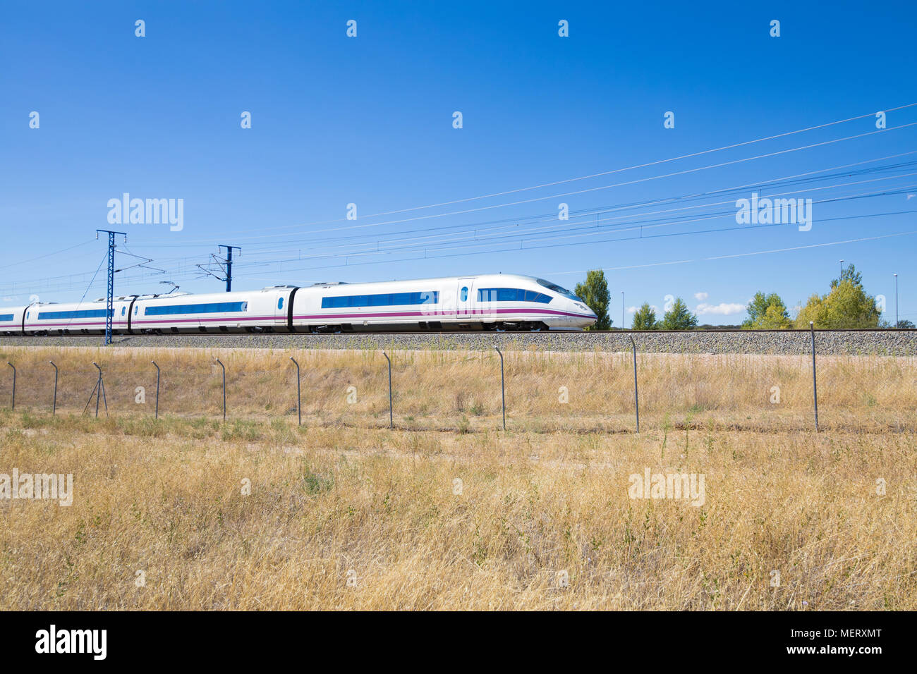 locomotive and wagons of spanish public high speed train on railway in ...