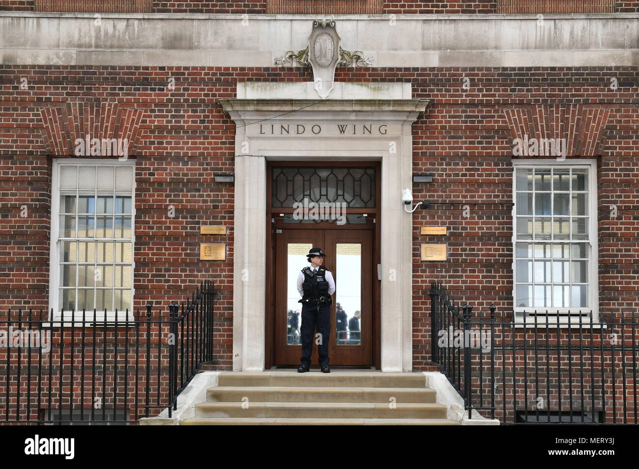 A police officer stands outside the Lindo Wing at St Mary's Hospital in ...