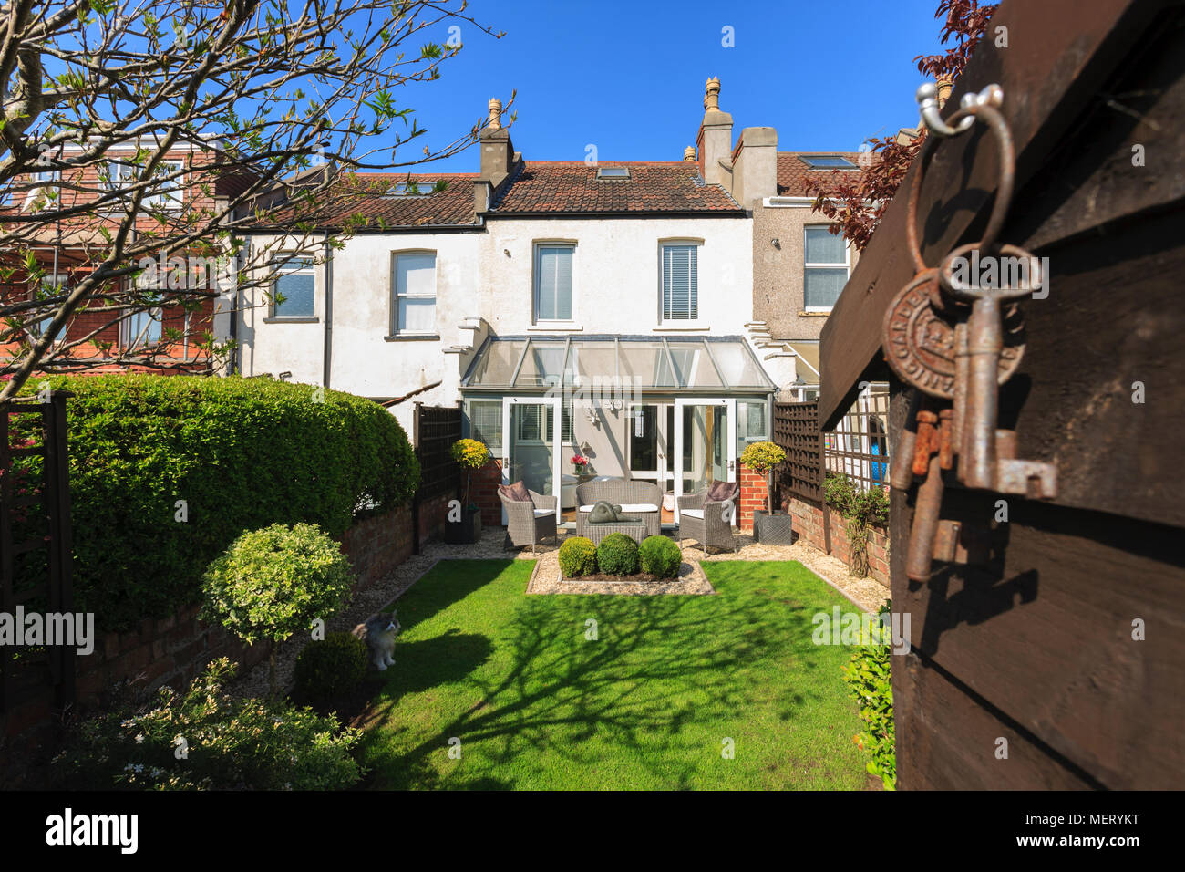 A view of the back garden of a mid-terraced town house Stock Photo - Alamy