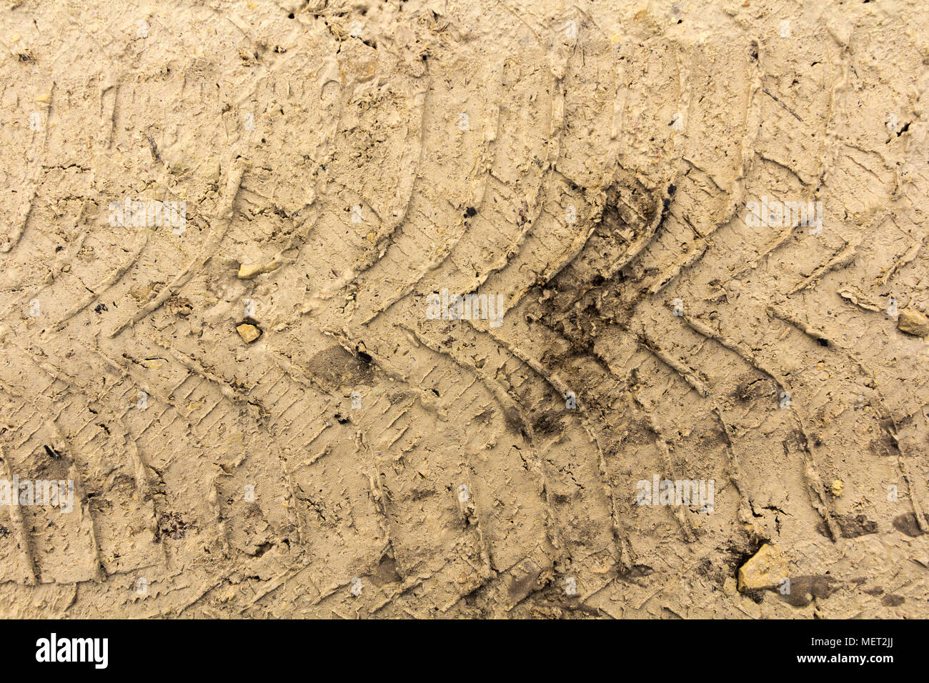Tire tracks on a wet muddy road, abstract background Stock Photo - Alamy