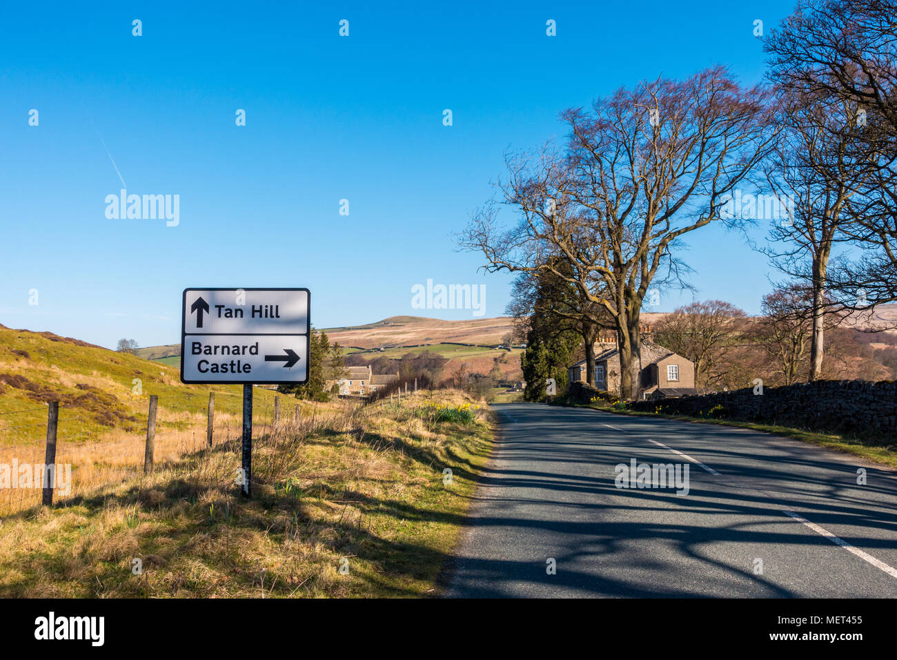 Looking up the road with a Tan Hill and Barnard Castle sign in the ...