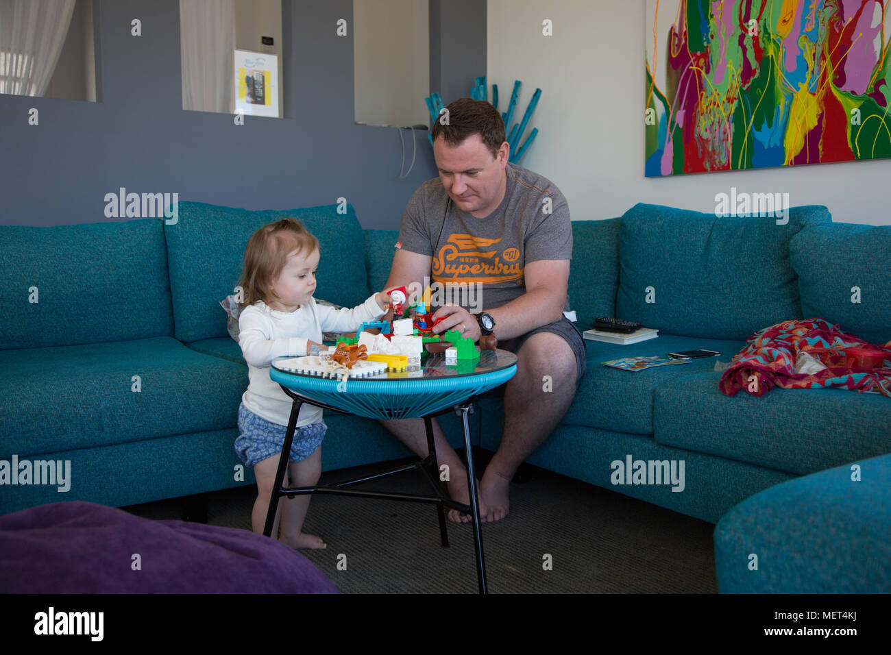 Father and daughter playing with Duplo Stock Photo - Alamy