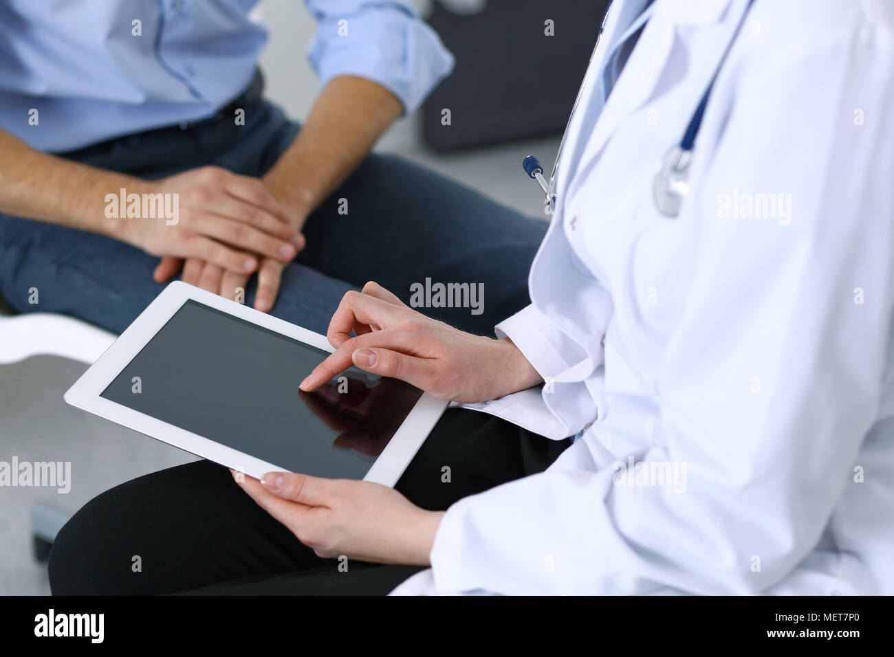 Doctor holding ipad hi-res stock photography and images - Alamy
